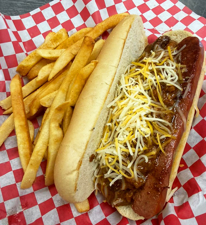 A chili cheese dog that demands both napkins and respect, with fries crisp enough to stand at attention.
