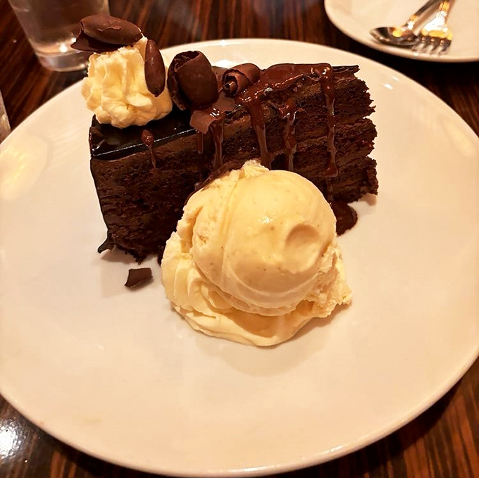 Chocolate mousse cake with ice cream, proving that dessert is always worth saving room for here.