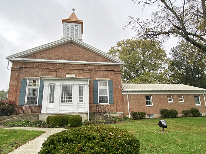 Brick and blue shutters make this Presbyterian church both stately and approachable, a spiritual anchor in Clifton's historical landscape.