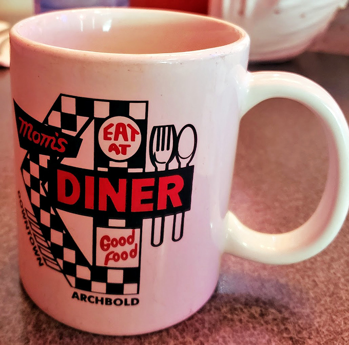The coffee mug says it all&mdash;good food in a checkered wonderland where every sip comes with a side of small-town charm.