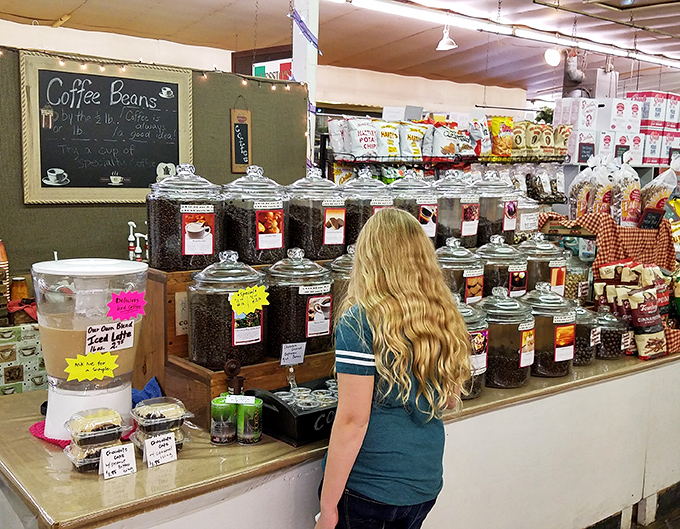Coffee beans by the pound, displayed like precious gems but priced like the everyday necessity they are.