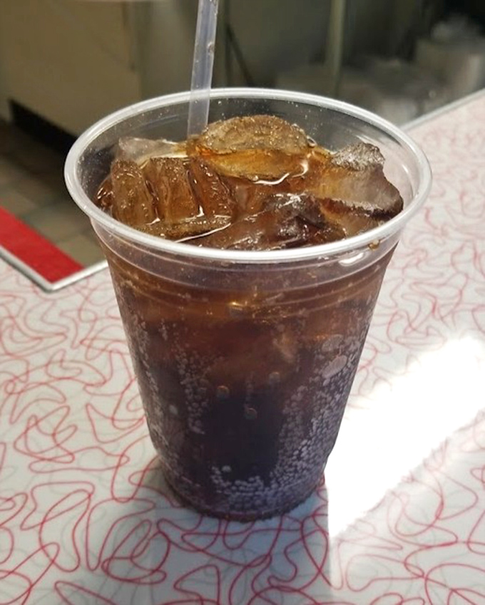A cola so perfectly iced it makes that plastic cup look like fine crystal. The ideal companion to cut through all that delicious diner richness.