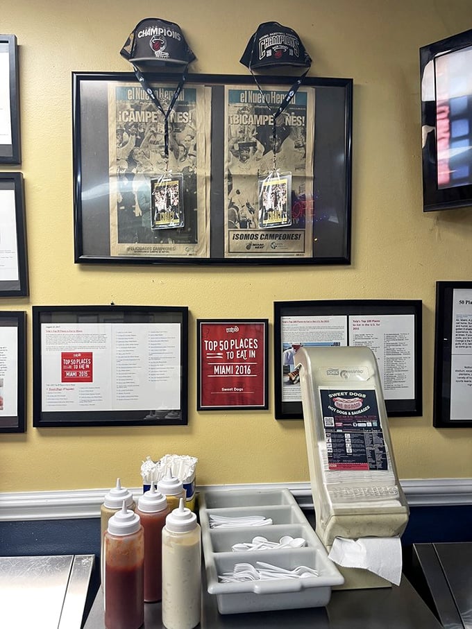 The wall of fame showcases Sweet Dogs' accolades, including a "Top 50 Places to Eat in Miami" award that locals know is well-deserved.