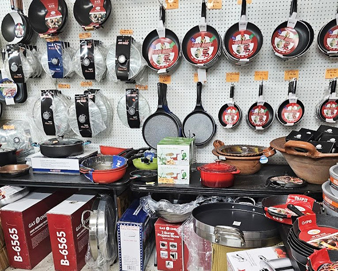 Cookware hangs like kitchen constellations, each pot and pan promising culinary adventures for home chefs looking to upgrade their arsenal.