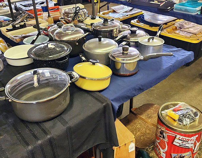 Yesterday's cookware awaits new kitchens, each pot and pan holding the ghosts of family recipes and Sunday dinners past.