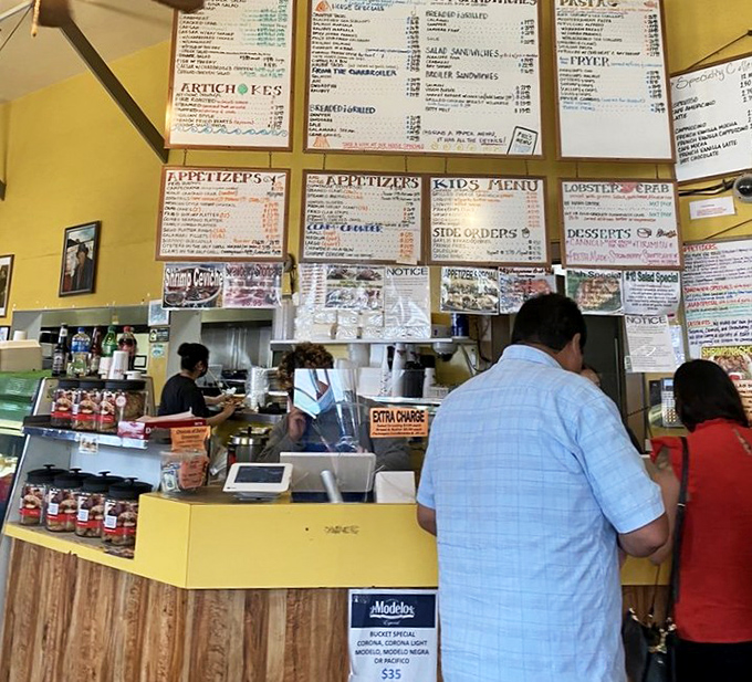 Order here, but decide quickly! The menu board system is organized chaos that somehow delivers culinary perfection to your table.