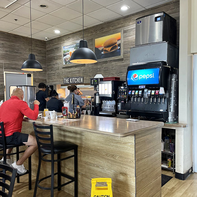 Counter seating offers front-row tickets to the breakfast show, where coffee flows freely and conversation comes easy.