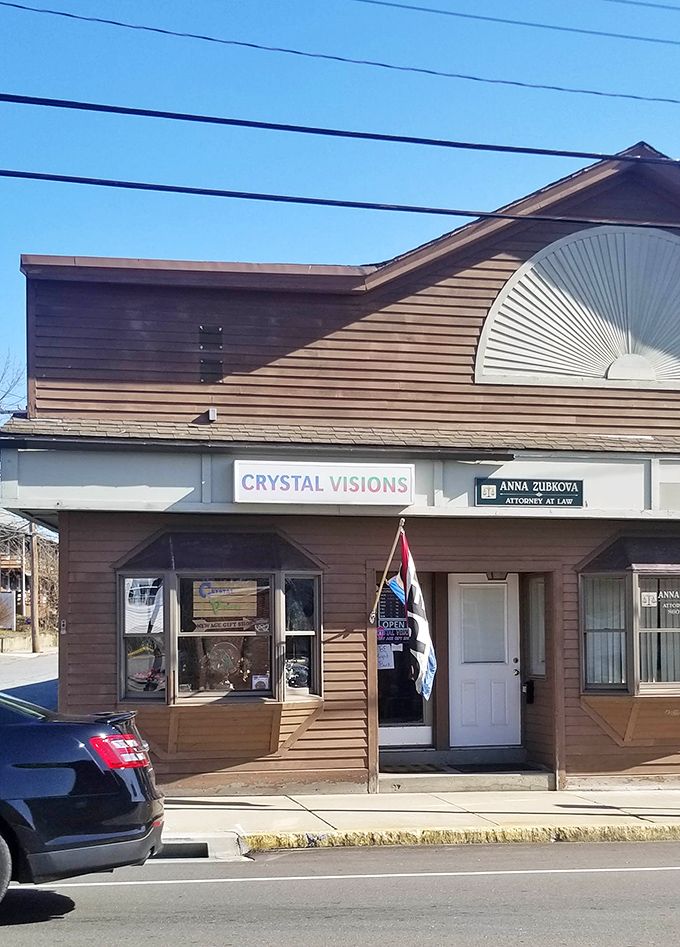 Crystal Visions shares a building with legal counsel—perfect for when your fortune telling needs notarization. Small-town efficiency at work.
