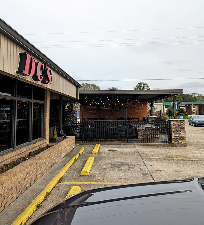 DC's Sports Bar & Steakhouse offers a welcoming patio where locals gather to share stories and savor the flavors of Louisiana.