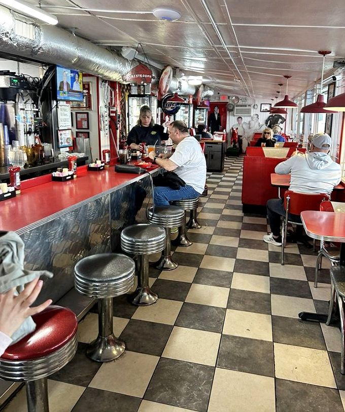The counter is where strangers become friends and regulars become family. Notice how everyone's posture says "I'm exactly where I should be."