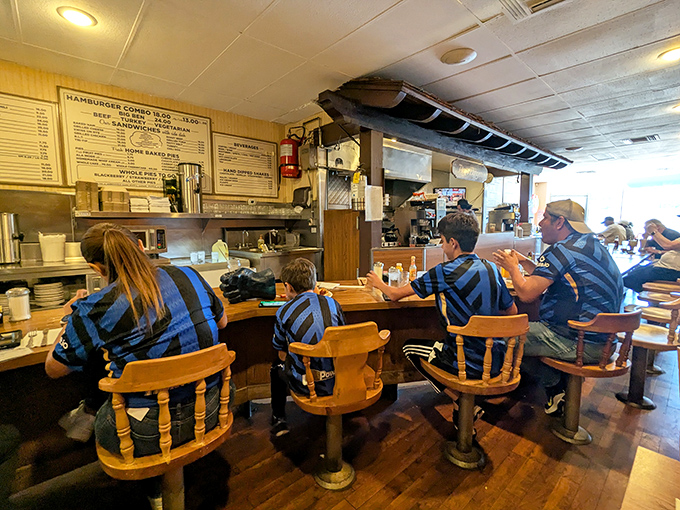 Families gather at the counter, continuing traditions started decades ago. Some kids' first burger memories are being made right here, right now.