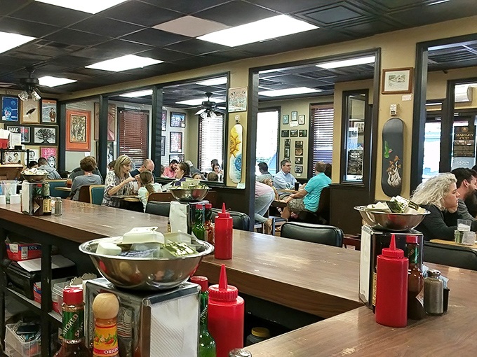 The dining room buzzes with the energy of shared experience&mdash;strangers united by the universal language of "mmm" and "pass the hot sauce."