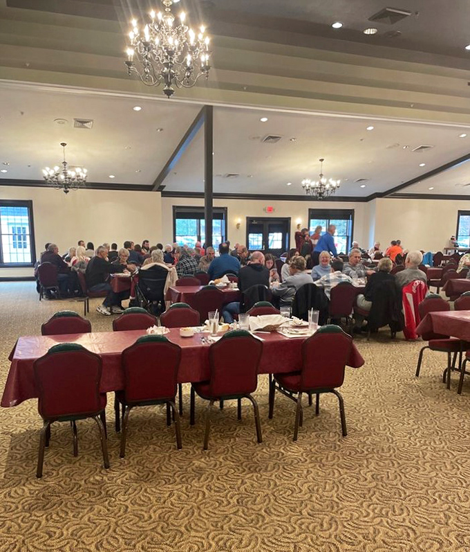 Crystal chandeliers cast a warm glow over tables of guests who came as customers but leave as converts to the church of Amish comfort food.