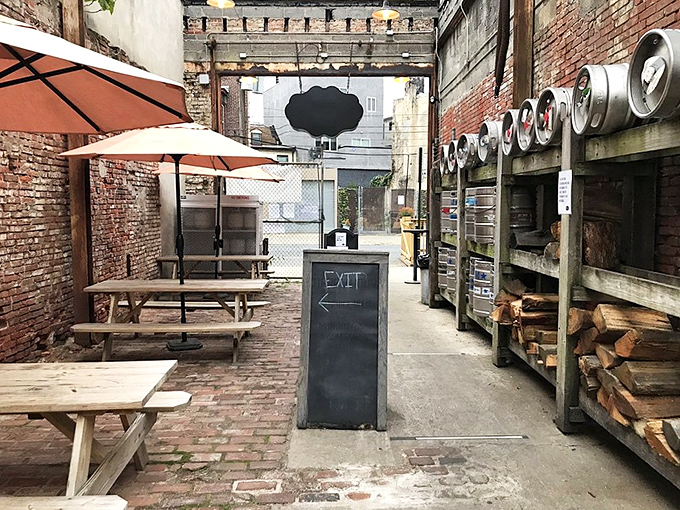 The outdoor patio with stacked firewood reminds you that great barbecue starts with the right fuel and plenty of patience.