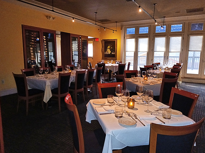 Elegant simplicity defines the dining room, where each table setting awaits its starring role in your evening's gastronomic performance.