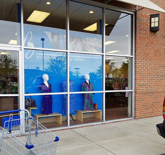 The window display showcases professional attire with purpose. These mannequins aren't just modeling clothes&mdash;they're modeling Goodwill's mission of workforce empowerment.