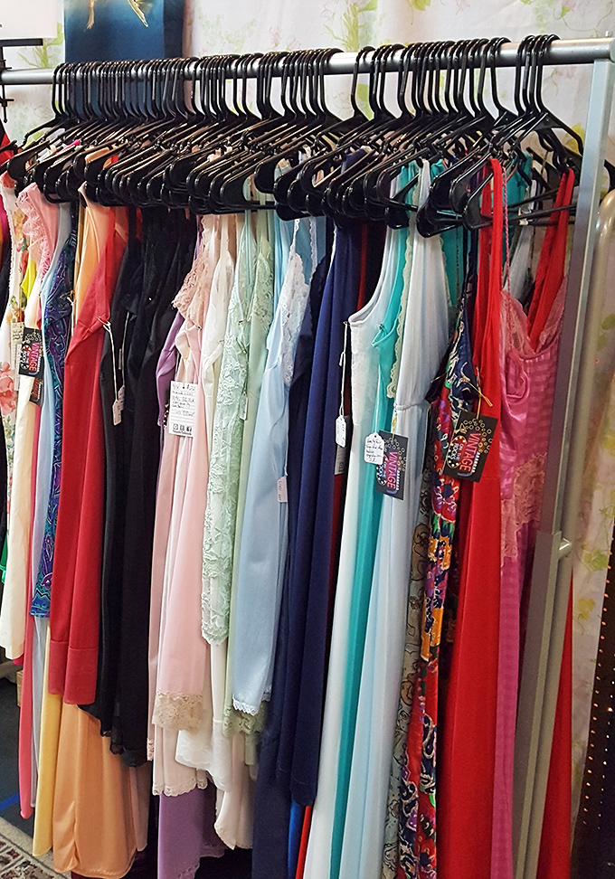 A rainbow of vintage formal wear, each dress holding memories of proms, weddings, and nights that mattered.