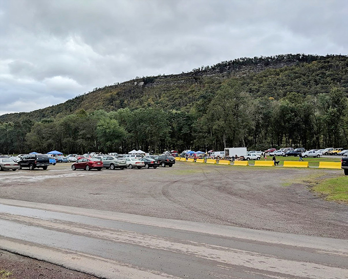 The parking lot fills with anticipation as the mountains stand watch over another night of cinematic magic.