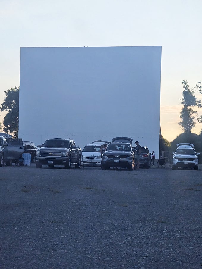 Early arrivals stake their claim as the screen awaits its nightly transformation into a portal of storytelling.