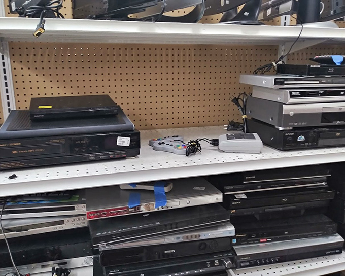 DVD players and stereo equipment stacked like technological layer cake&mdash;each shelf a different era of how we once consumed media.