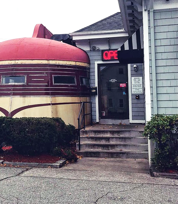 The entrance promises breakfast salvation with its glowing "OPEN" sign&mdash;three steps that separate you from pancake paradise.