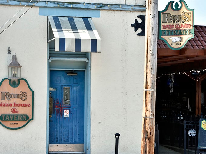 The blue door entrance to Ron's Pizza House & Tavern stands like a portal to a simpler time when restaurants didn't need gimmicks &ndash; just really good food.