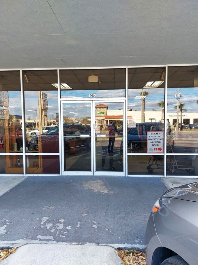 The entrance beckons with promises of discoveries within, like the wardrobe to a thrifting Narnia for budget-conscious adventurers.