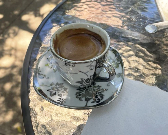 Delicate floral china elevates this espresso moment. Outdoor tables turn coffee breaks into mini European vacations in downtown Davenport.