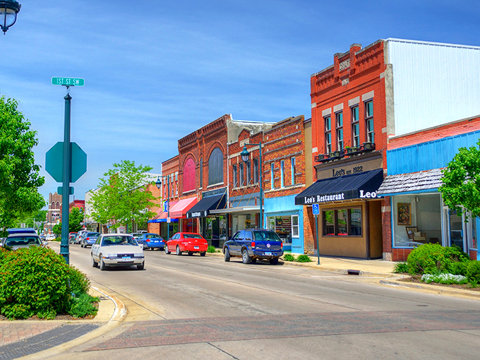 Frederick Avenue in summer bloom showcases Oelwein's picture-perfect downtown, where historic buildings house modern businesses in a palette of Americana. 