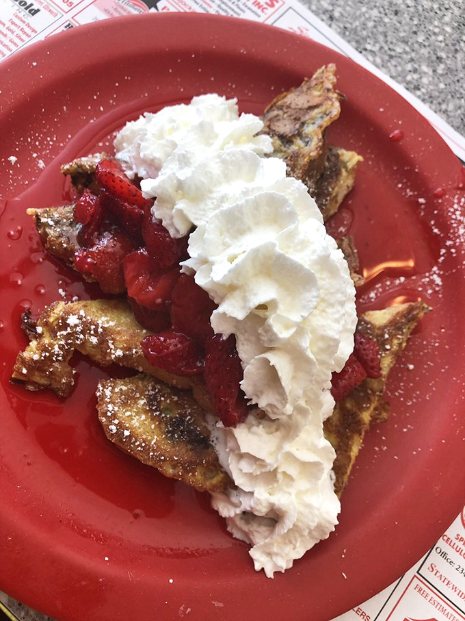 French toast that's had a romantic encounter with strawberries and whipped cream. A breakfast affair to remember.