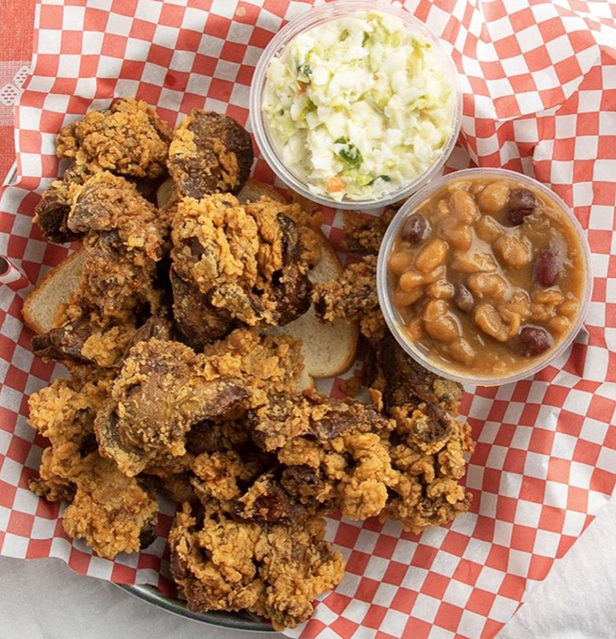 Fried chicken with all the fixings&mdash;coleslaw and baked beans standing by to cut through the richness. A plate that demands to be photographed.