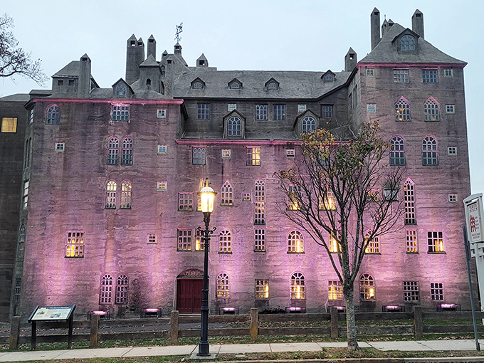 Twilight transforms the castle into something truly magical. Evening illumination highlights the museum's dramatic silhouette and architectural details in spectacular fashion.