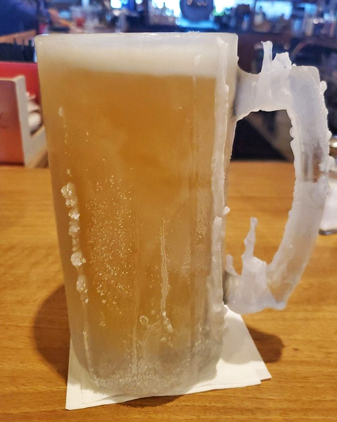 A frosty mug of beer so cold it makes you wonder if they've got a secret portal to Antarctica in the kitchen.