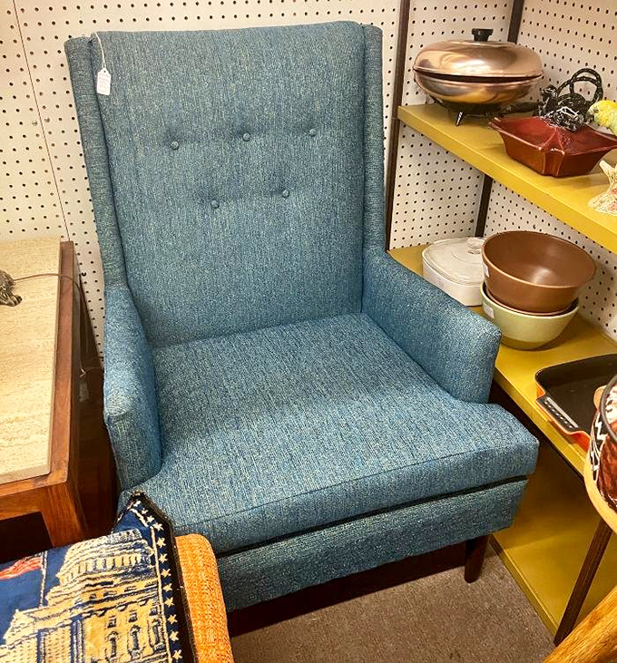 That mid-century blue armchair isn't just furniture&mdash;it's a time portal to 1962 waiting for you to sink in and contemplate life without smartphones.