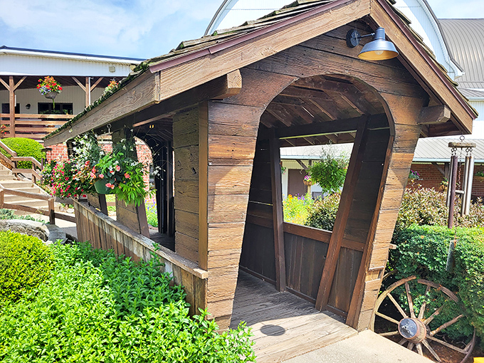 Not just an entrance&mdash;a transition from the ordinary world to flavor country. This charming covered bridge welcomes you with flowers and rustic charm.