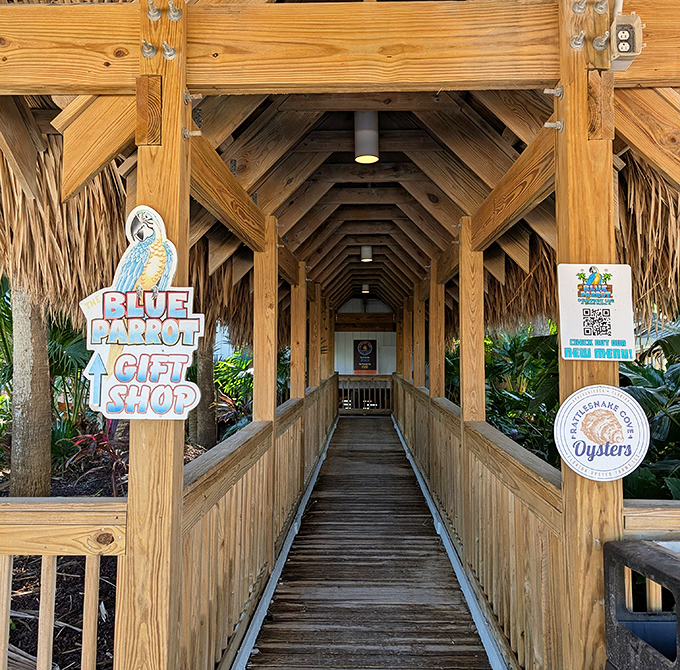 The wooden walkway to seafood nirvana—where every step brings you closer to that perfect meal with your toes practically in the sand.