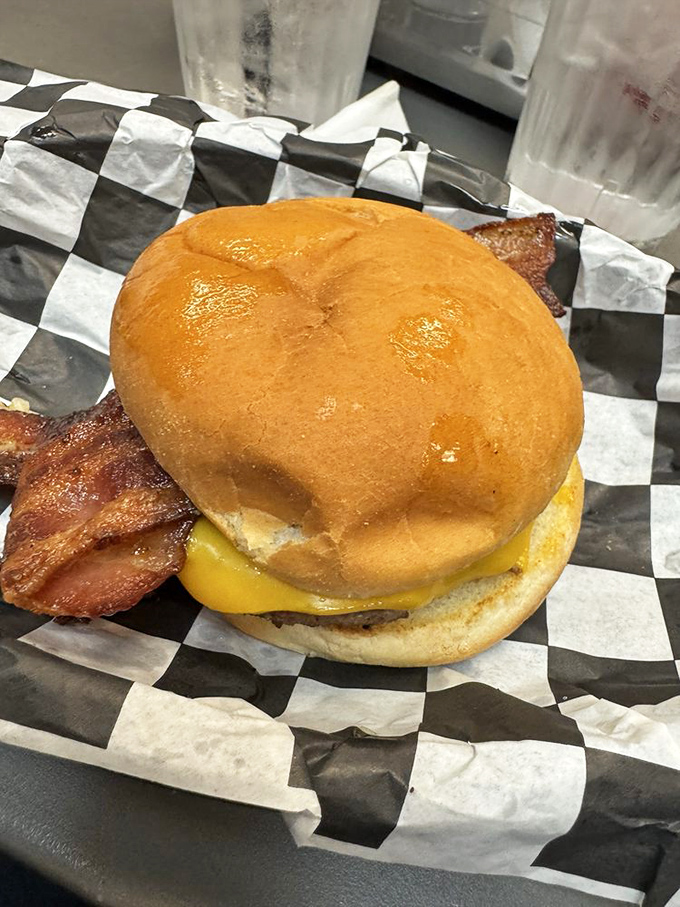 The Glacier Burger with bacon peeking out&mdash;a sandwich so good it would make even the most dedicated health food enthusiast temporarily convert.