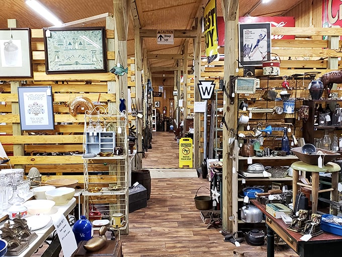 The narrow pathways between treasures create a maze of discovery, where each wooden post supports not just the ceiling but decades of American material culture.