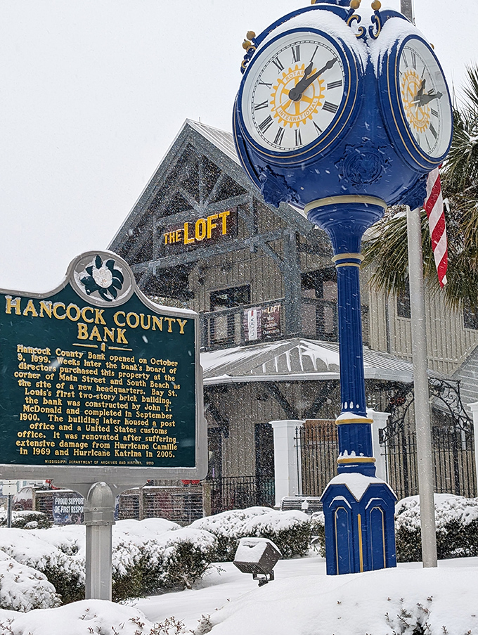 Even in rare Mississippi snow, history stands proud. The Hancock Bank clock tower keeps perfect time through seasons that locals swear aren't supposed to include winter.