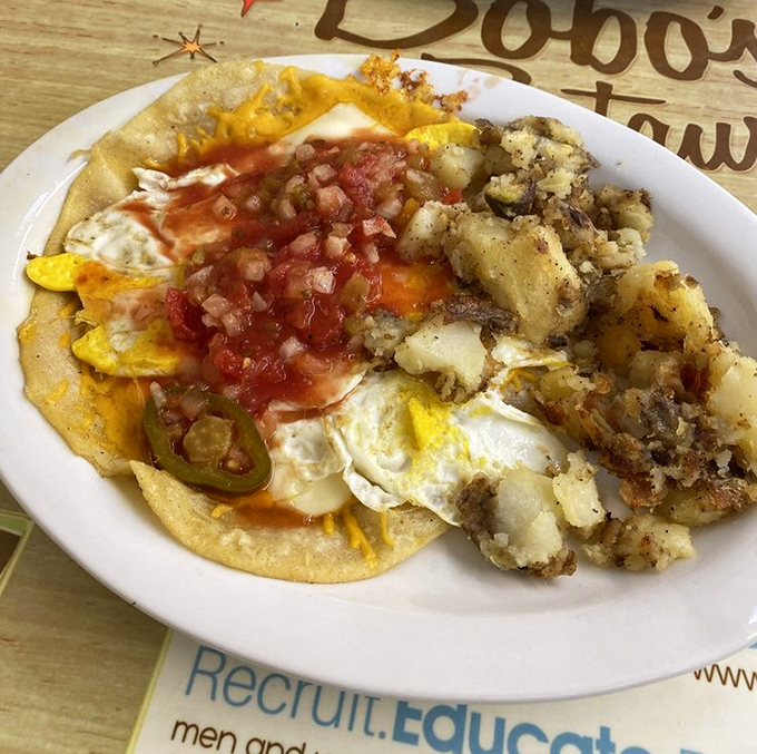 Huevos Rancheros: where eggs, tortillas, salsa, and potatoes unite to create the breakfast equivalent of a fiesta on your taste buds.