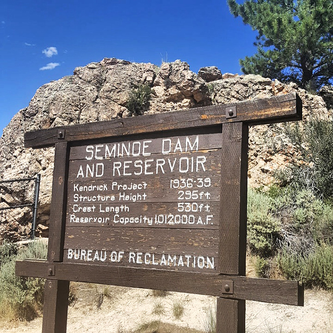 History carved in wood &ndash; this sign tells the tale of Depression-era engineering that transformed a river into Wyoming's best-kept aquatic secret.