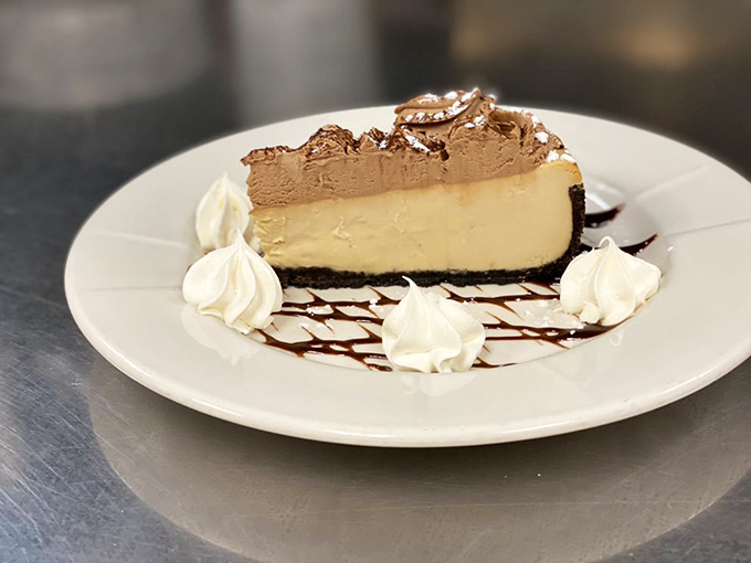 Cheesecake elevated to art form status. That chocolate-to-vanilla ratio is mathematical perfection, with whipped cream dollops as the exclamation points.