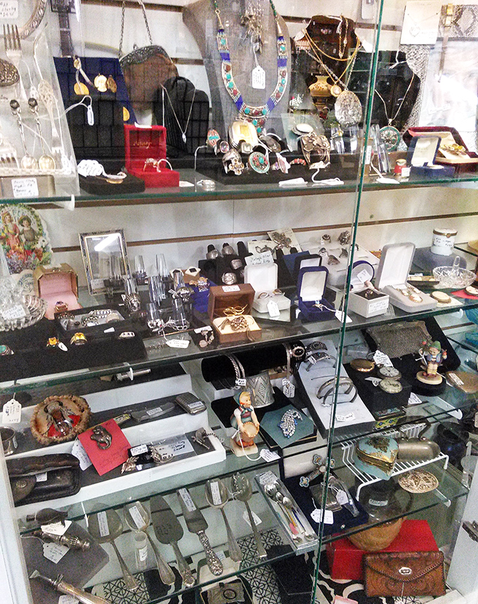 Lamps illuminate furniture vignettes that feel like movie sets from different eras. Mid-century meets Victorian in this time-traveling furniture showroom.