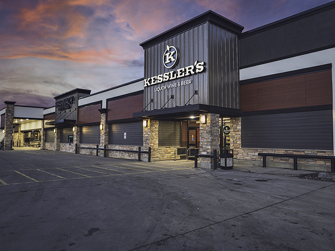Kessler's glows at twilight, a modern gathering place where locals toast life's moments against Dakota's dramatic skies.