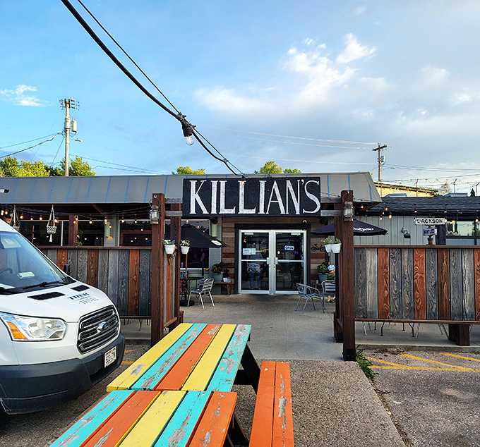 Killian's colorful picnic tables invite you to linger over local fare, proving good taste extends beyond the menu.