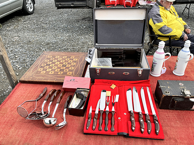 Vintage cutlery sets and serving pieces await their next dinner party. These silent butlers have served meals across decades of American tables.