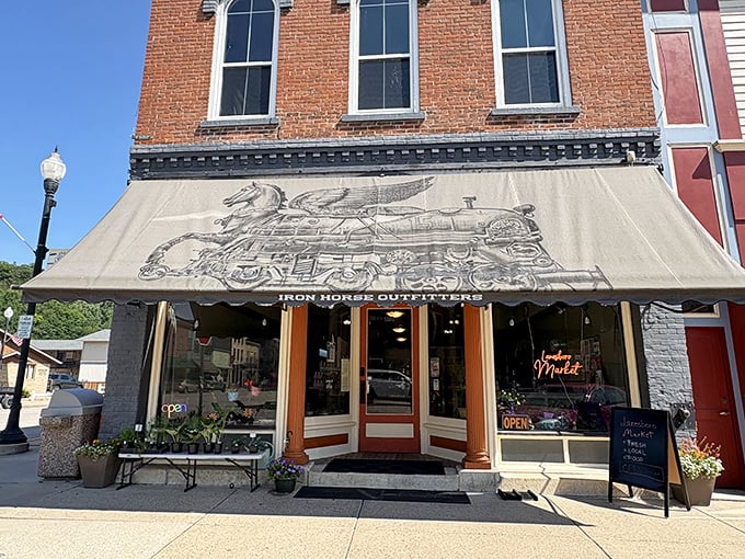 Iron Horse Outfitters occupies a storefront where vintage advertising meets modern adventure gear in perfectly harmonious small-town style.