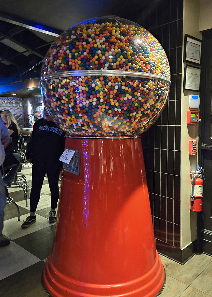 The giant gumball machine stands as a colorful reminder that sometimes the best dining experiences come with a side of childlike wonder.