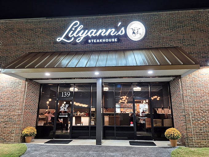 Lilyann's Steakhouse glows invitingly at dusk, promising sizzling perfection without the big-city markup that requires a loan application.