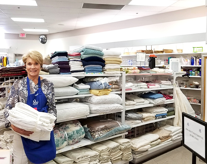 Linens department dreams come true with a helpful volunteer. These sheets and towels are ready for their second act in your linen closet.